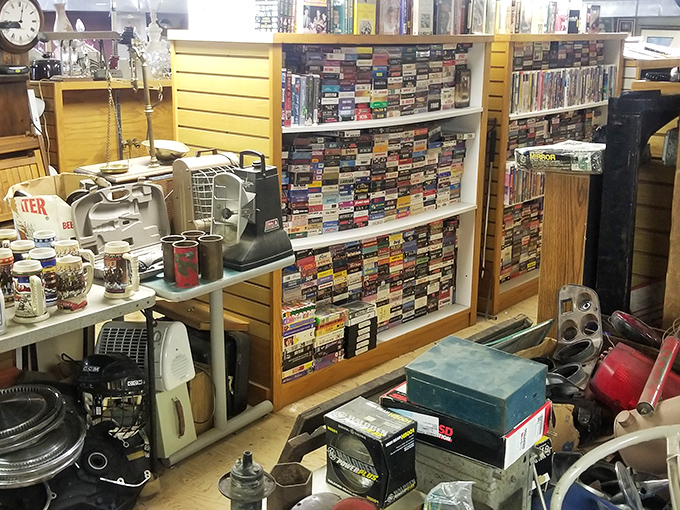 Treasure hunting paradise! Shelves packed with VHS tapes and household gadgets that tell the story of American innovation through the decades.