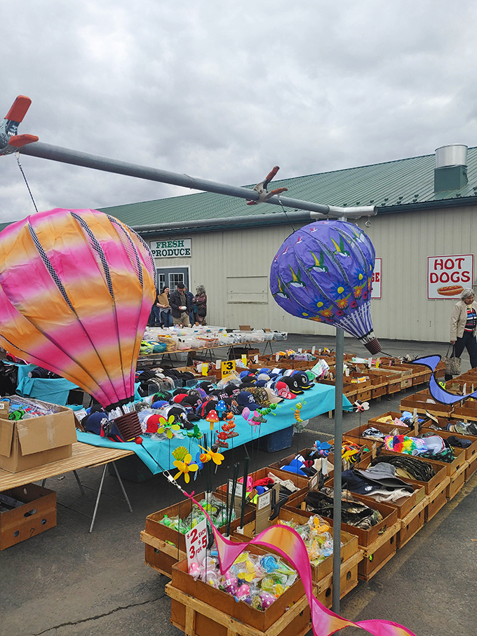 Colorful hot air balloon decorations hover above a sea of toys and trinkets, proving that at Silver Moon, even the displays float with whimsical charm.