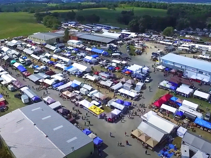 From above, the Pulaski County Flea Market transforms into a vibrant patchwork quilt of tents, treasures, and determined bargain hunters stretching across acres of Virginia countryside.