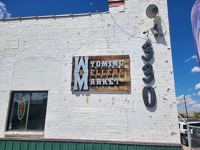 The white-washed exterior of Wyoming Sellers Market stands like a beacon for bargain hunters under that big Wyoming sky.