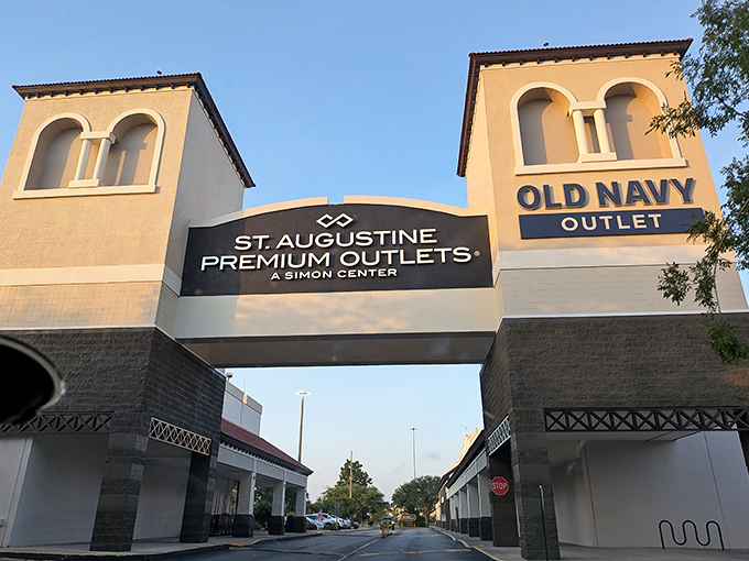 The grand entrance to St. Augustine Premium Outlets beckons with its Spanish-inspired architecture, promising retail adventures that won't require a second mortgage.