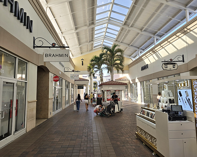 Sunlit walkways, palm trees, and Spanish-tile accents give Orlando International Premium Outlets an effortless vacation vibe as shoppers stroll between its open-air storefronts.
