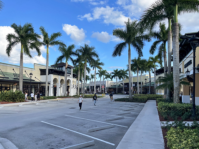 Palm trees stand sentinel along The Colonnade Outlets' elegant promenade, welcoming shoppers to Florida's most sophisticated bargain hunting grounds.