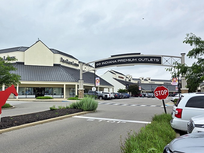 The welcoming archway at Indiana Premium Outlets beckons like a gateway to bargain paradise on I-65.