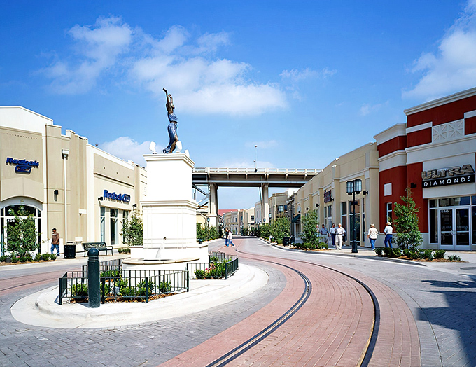 The brick pathways curve like a treasure map leading to retail riches, with River views as your bonus prize.