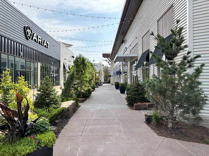 Strolling these beautifully landscaped walkways between stores feels more like a European promenade than an outlet mall&mdash;string lights included for that touch of magic.