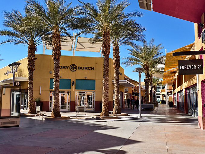 Palm trees and premium brands create the perfect retail oasis. Tory Burch and Forever 21 coexist in this shopper's paradise where desert meets discount.