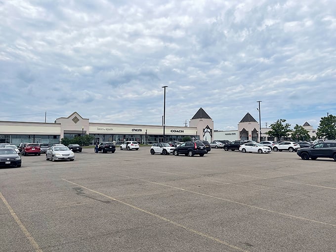 The Coach store beckons under cloudy skies&mdash;nature's way of saying "the real storm will be in your wallet, but totally worth it."