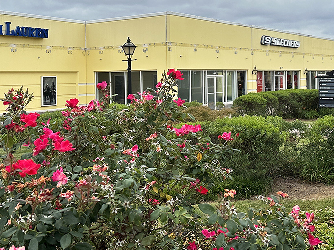 The sunny yellow facade of Tommy Hilfiger welcomes bargain hunters like a beacon of hope for both style and savings.