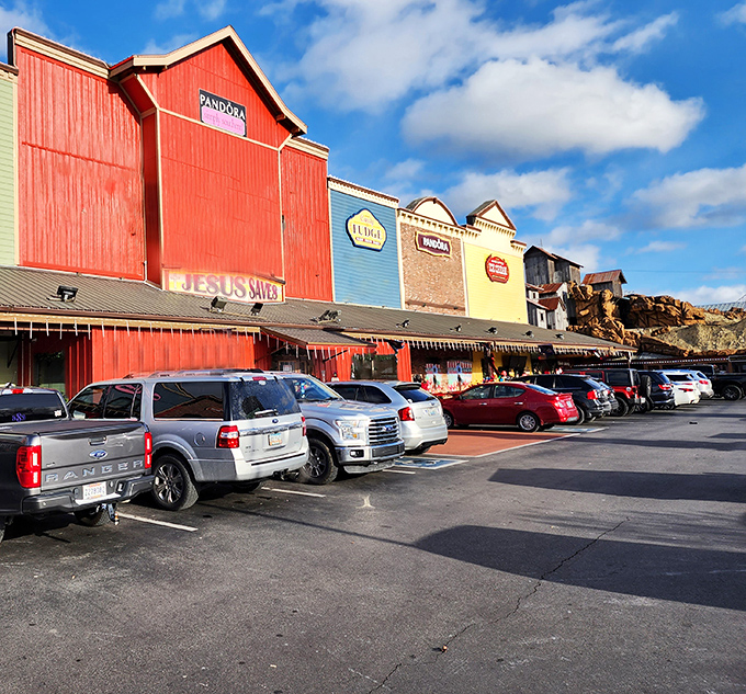The iconic barn-red facades of Pigeon Forge Factory Outlet Mall stand like beacons of bargain-hunting hope against the Tennessee sky.