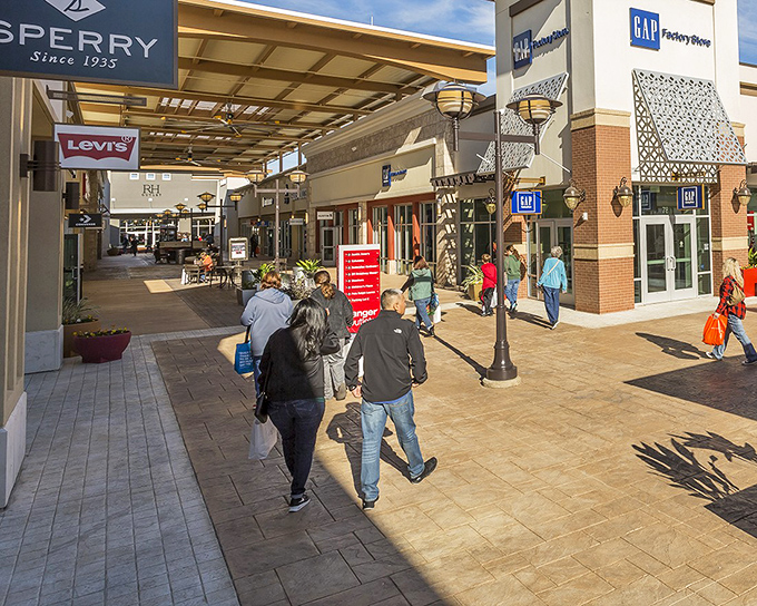 Inside Tanger Outlets Fort Worth, modern architecture creates a vibrant shopping paradise where eager customers explore deals beneath the Texas sky.