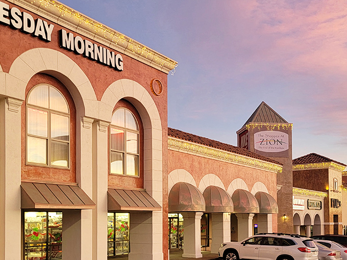 The warm terracotta facade of Outlets at Zion glows in the sunset light, promising retail adventures within its southwestern-inspired architecture.