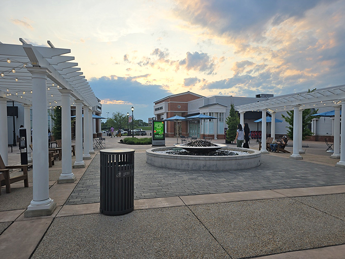 As the sun sets over the outlet's elegant pergola and central fountain, shoppers find a moment of tranquility between bargain-hunting expeditions.