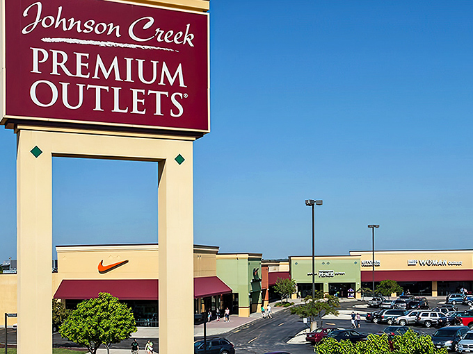 The retail promised land beckons with its burgundy sign, where credit cards tremble and shopping bags multiply faster than Wisconsin mosquitoes in July.