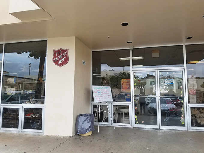 The iconic red shield welcomes bargain hunters to this unassuming treasure trove, where Hawaii's best deals hide behind modest doors.