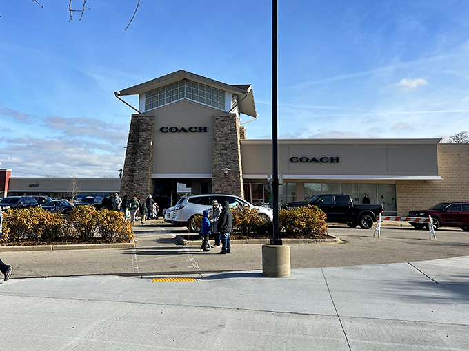 The Coach store stands as a beacon of hope for handbag enthusiasts, where luxury meets affordability under the pleasant Wisconsin sky.