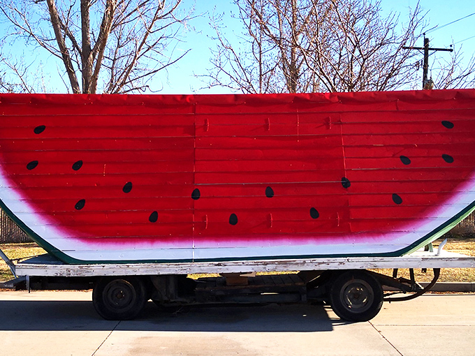 The Eighth Wonder of the Fruit World stands proudly under its shelter, a monument to summer sweetness that makes roadtrippers slam on their brakes.