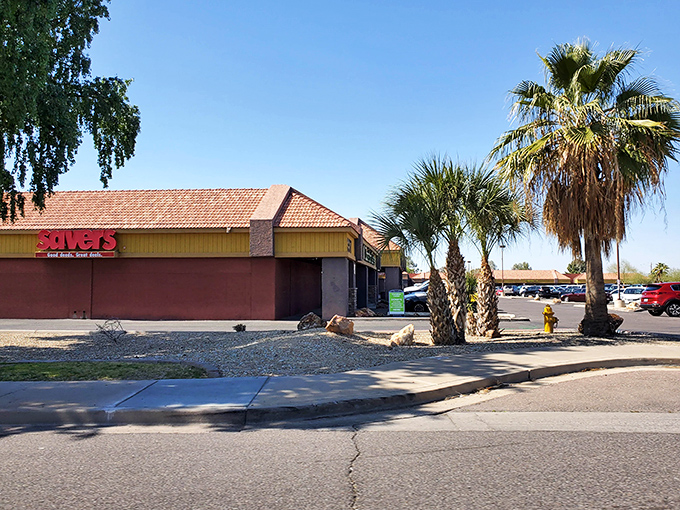 The iconic red Savers sign glows against the Arizona sunset, a beacon of bargain-hunting hope for thrifty shoppers across Phoenix.