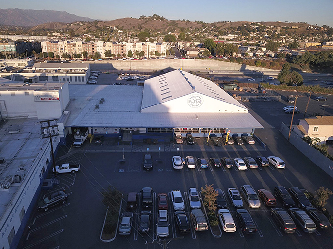 From above, the distinctive white roof with the SVdP logo stands out like a beacon for bargain hunters across Los Angeles.