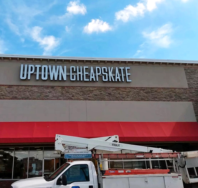 The storefront beckons like a fashion oasis against the Maryland sky. That red awning might as well be a red carpet for your wallet's grand entrance.