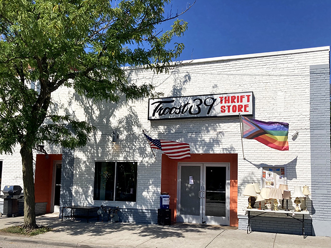 The welcoming facade of Troost39 Thrift Store, where American flags and rainbow colors signal this treasure trove welcomes all bargain hunters.