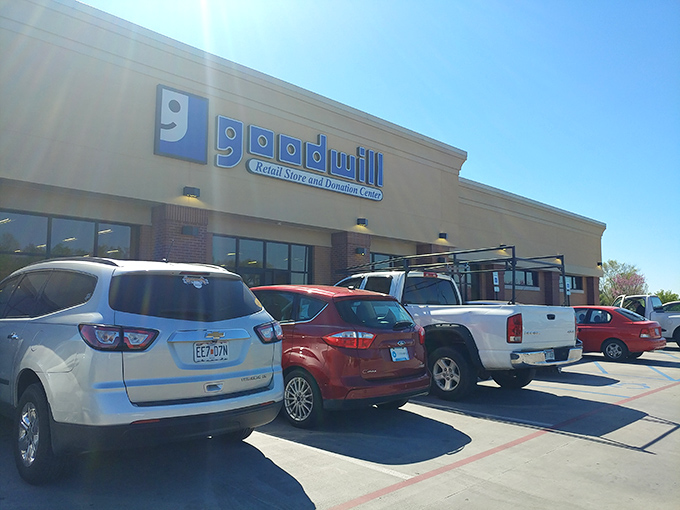 The blue Goodwill sign beckons bargain hunters like a retail lighthouse, promising treasures inside that won't break the bank.