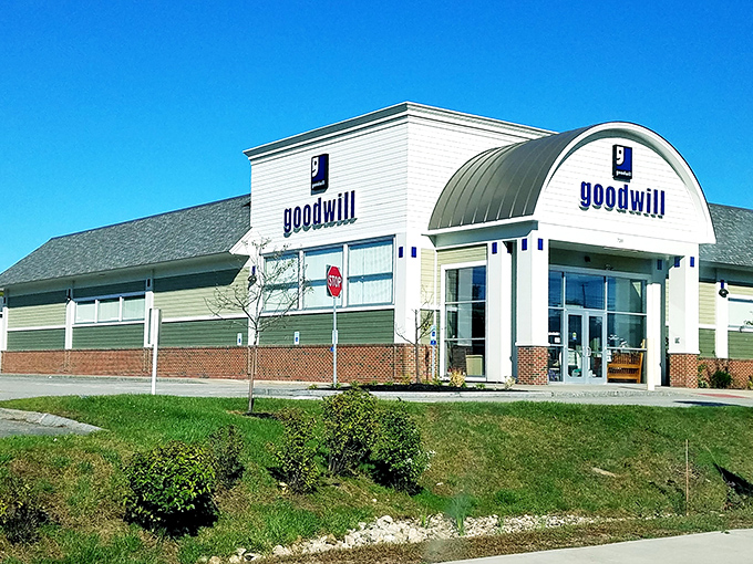The distinctive curved roof and clean white siding of Portsmouth's Goodwill beckons like a treasure chest waiting to be opened.