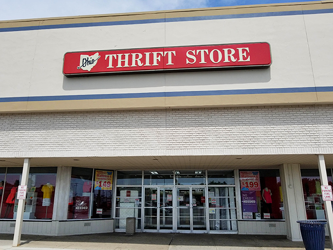 That iconic red sign beckons bargain hunters like a lighthouse for the thrifty, promising adventures in secondhand splendor just beyond those glass doors.