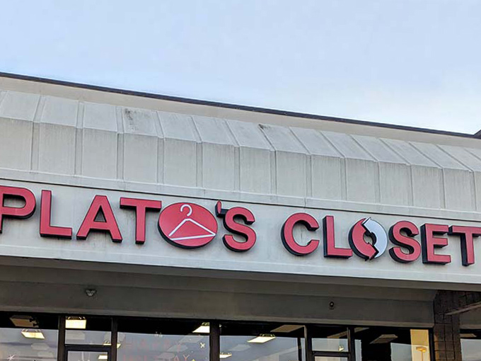 The iconic red Plato's Closet sign beckons like a fashion lighthouse, guiding bargain hunters safely away from full retail prices.