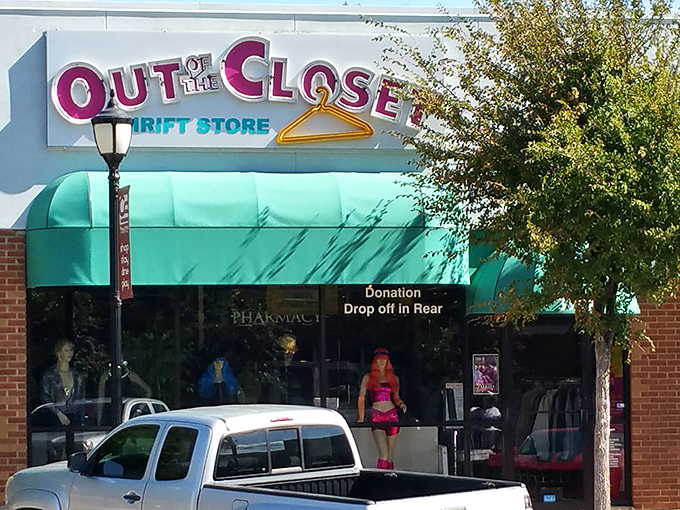 The unmistakable green exterior and pink sign at Out of the Closet make shopping feel more like a treasure hunt than a typical thrift store visit.