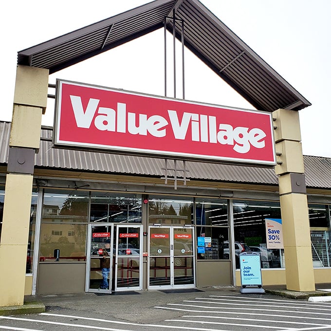 The iconic red and white sign beckons bargain hunters like a retail lighthouse, promising treasures within this Burien secondhand wonderland.