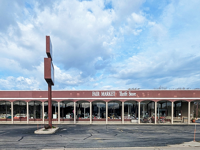 The brick-red exterior of Fair Market Thrift Store stands like a beacon of bargain possibilities under Wisconsin's ever-changing sky.