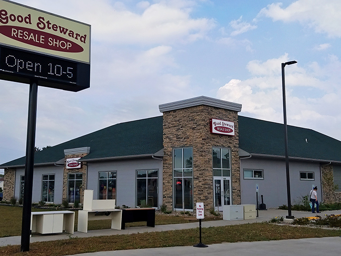 The modern stone facade of Good Steward Resale Shop stands proudly against Wisconsin's blue sky, promising treasures within that won't break your piggy bank.
