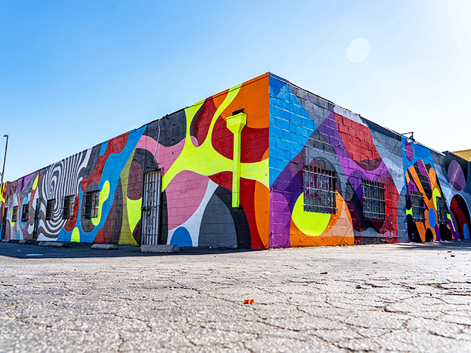 Vibrant murals transform ordinary buildings into extraordinary backdrops. This geometric explosion of color perfectly captures the Silverlake Flea's creative spirit.