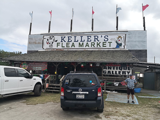 The weathered sign of Keller's Flea Market stands like a beacon for treasure hunters, promising adventures in bargain-hunting beneath its rustic roof.