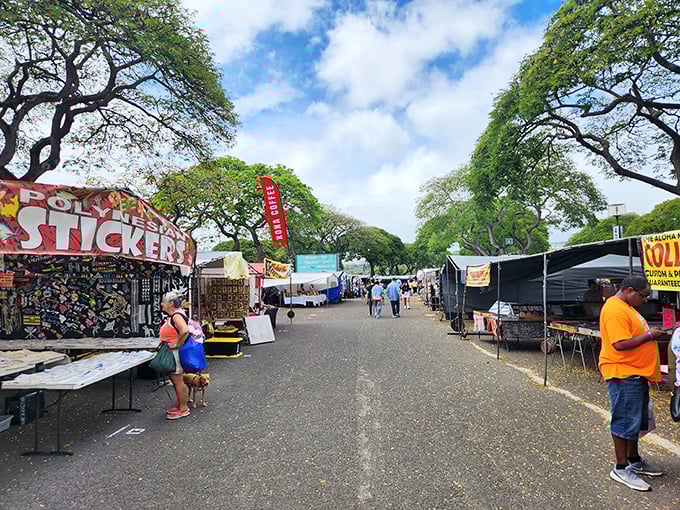 Welcome to bargain paradise! The Aloha Stadium Swap Meet stretches out under majestic monkeypod trees, creating a shopper's oasis where treasures await around every corner.
