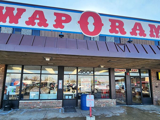 The iconic red Swap-O-Rama sign beckons bargain hunters like a retail lighthouse, promising treasures within that big-box stores can only dream about. 