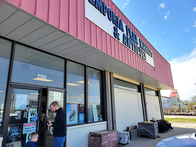 The pink facade of Emporia Flea Market & Antiques stands out like a beacon for treasure hunters. No corporate sameness here&mdash;just the promise of discoveries waiting inside.
