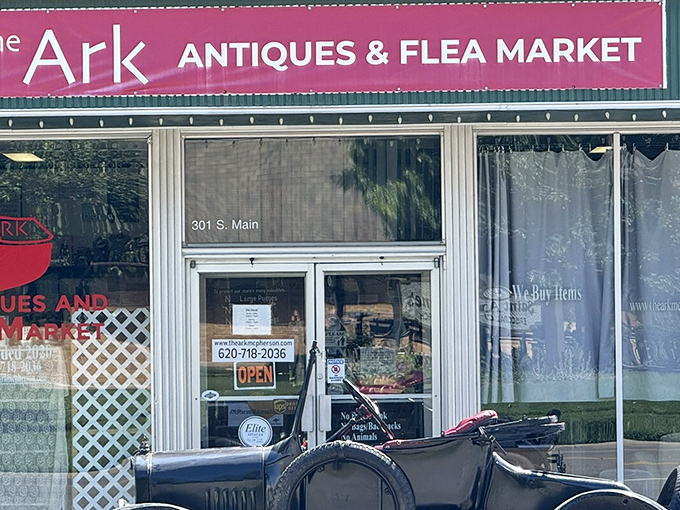 The bright red sign beckons like a lighthouse for treasure hunters. The Ark's vintage storefront promises adventures that begin the moment you step inside.