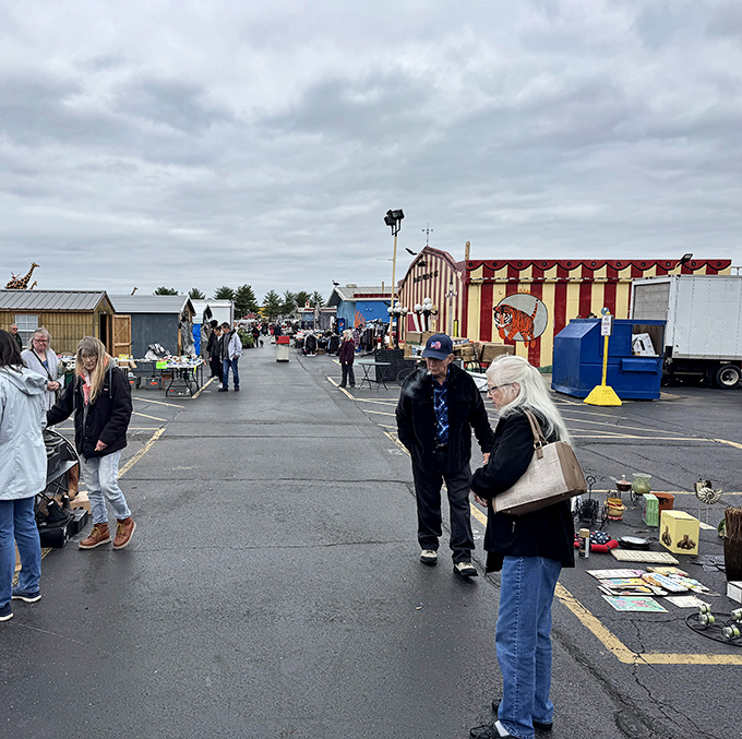 The outdoor section at Traders World is where treasure hunting meets social hour. Shoppers browse under cloudy skies, proving bargain-seeking is an all-weather sport.