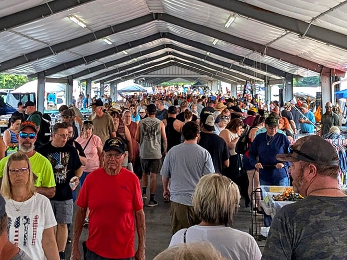 The bustling heart of Rogers Flea Market, where treasure hunters navigate a sea of possibilities under one massive roof. Weekend warriors, start your engines!