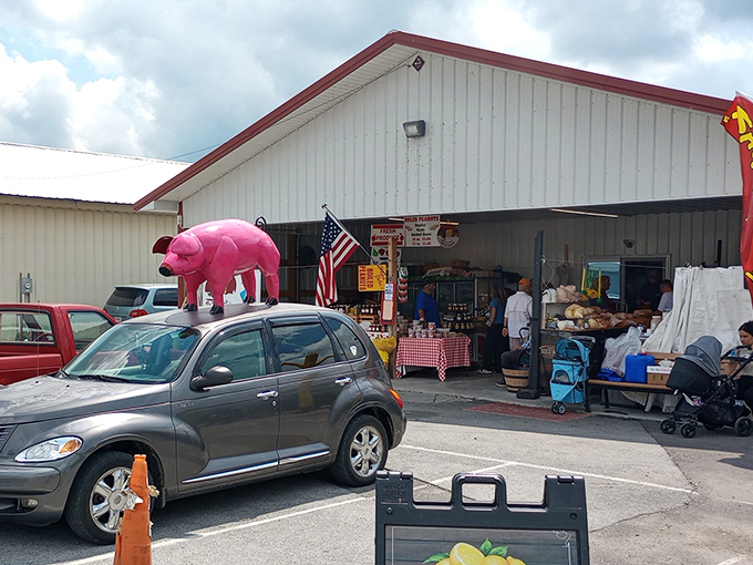 The famous pink pig car topper serves as the unofficial mascot and meeting point. "Meet me by the flying pig" is flea market code.
