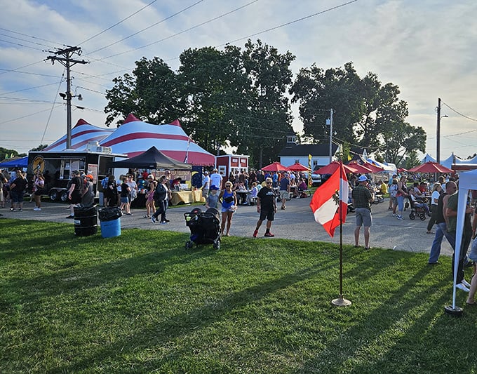 The golden hour casts a nostalgic glow over the fairgrounds as shoppers navigate a sea of tents, each one a portal to the past.