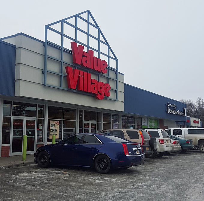 The blue-fronted fortress of frugality stands ready for bargain hunters, its triangular entrance beckoning like a North Star for the thrift-savvy Alaskan.