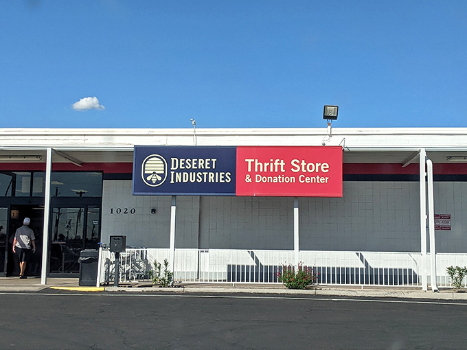 The unassuming exterior of Deseret Industries in Mesa hides a treasure trove within, like finding a secret passage in your favorite childhood book.