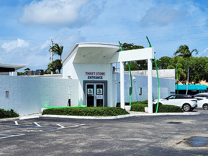 The distinctive green poles and clean storefront of Charity Thrift Stores stand out like a beacon for bargain hunters in Delray Beach.