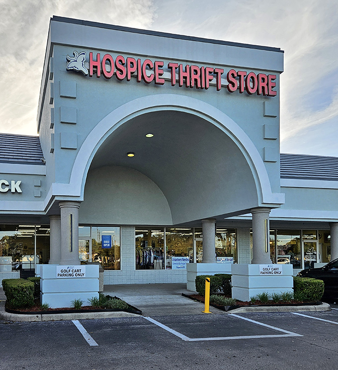 The grand entrance beckons like a portal to bargain heaven. Those "Golf Cart Parking Only" signs? Pure Florida retirement community gold.