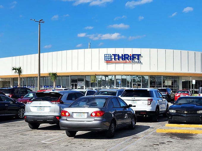 The patriotic facade of Red White & Blue Thrift Store stands proudly against the Florida sky, a temple of treasures waiting to be discovered by savvy shoppers.