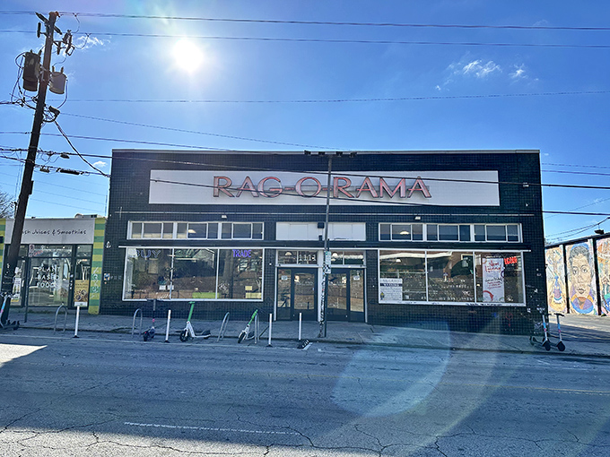 The black and white exterior of Rag-O-Rama stands like a fashion oasis in Little Five Points, beckoning bargain hunters with promises of sartorial treasures within.