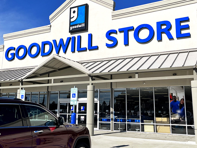 The blue Goodwill sign beckons like a lighthouse for bargain hunters. This Kenner location promises treasure hunting without the need for a metal detector.